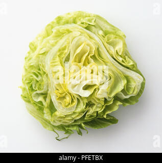 Sliced iceberg lettuce one section half and a quarter isolated on white ...