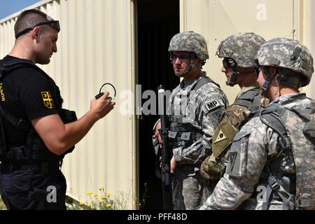 A Serbian Armed Forces special forces team member instructs U.S. Army ...