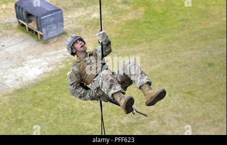 U.S. Army Soldiers rappel out of a UH-60 helicopter on April 20 at Camp ...