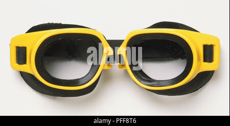 Close up shot of a yellow and black steam cleaner nozzle resting on a ...