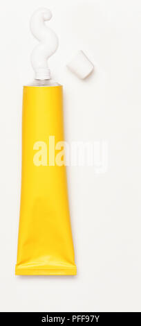Tube of toothpaste on yellow background, flat lay Stock Photo - Alamy