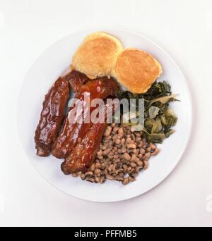 Spare ribs served on a white plate Stock Photo - Alamy