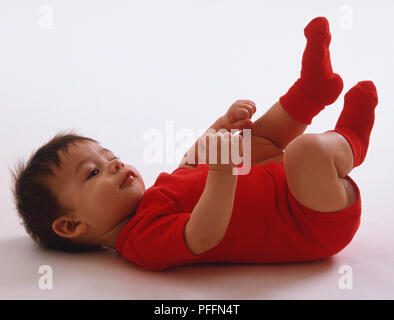 Feet wearing red socks Stock Photo - Alamy