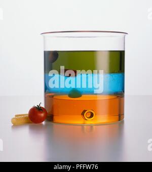 Glass containing layers of fluid of different densities, including ...