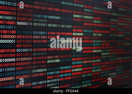Computer virus infection. Rows of binary codes randomly colored red and ...