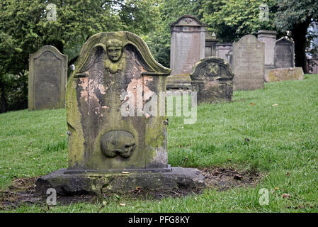 Gravestones in the grounds of the 19th century Church of St. Barrahane ...