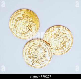 Close up shot of shiny coins separated in a special container Stock ...