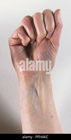 side view of clenched hands - hand gesture isolated on white background ...