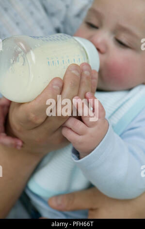 Man feeding baby Stock Photo - Alamy