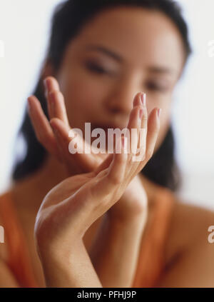 Woman bending her wrists backwards and crossing hands Stock Photo - Alamy