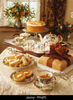 High Tea, or Afternoon Tea laid out on a table with traditional cups ...
