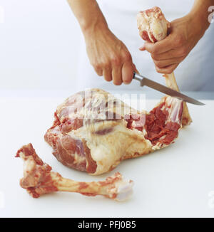Boning leg of lamb Stock Photo - Alamy