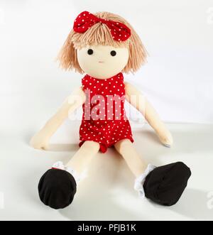 toy rag doll on red background. Art soft focus Stock Photo - Alamy