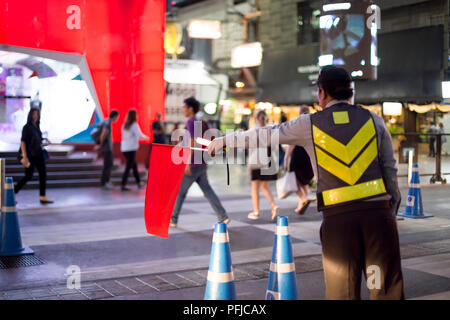 A handheld police traffic control sign with Halt Polizei, German for ...