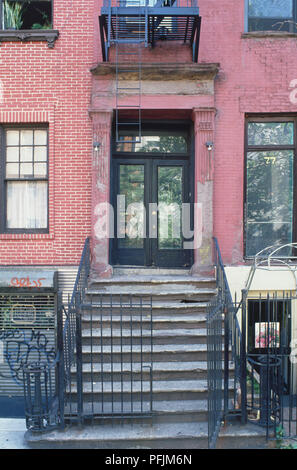 Close-up detail of new brick house top with two narrow plastic attic ...