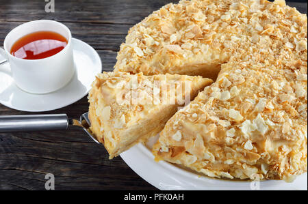 a piece of cake napoleon on plate with berries Stock Photo - Alamy
