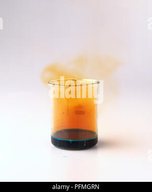 Chemical experiment in which Nitric acid (HNO3) is placed in an ...