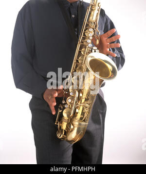 Saxophone in front of a white background, studio shot Stock Photo - Alamy