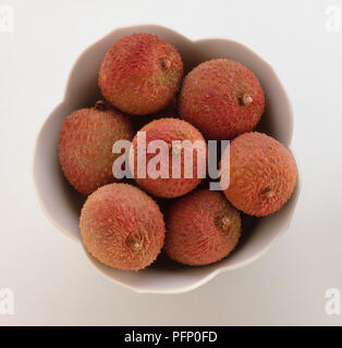 A close up view of a group of lychees, a tropical fruit from Asia ...
