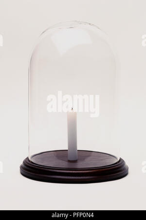 Burning candle in glass jar, succulent and notebook on wooden ...