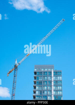 Crane. Construction crane. Huge crane against blue sky Stock Photo - Alamy
