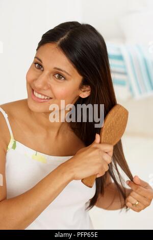 Close-up of a young woman brushing her teeth Stock Photo - Alamy