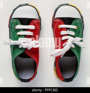 Pair of multi-coloured children's trainers Stock Photo - Alamy