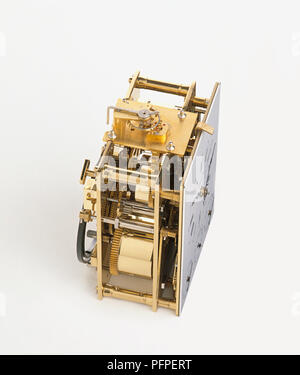 Carriage clock showing inside mechanism and key for winding up, side ...