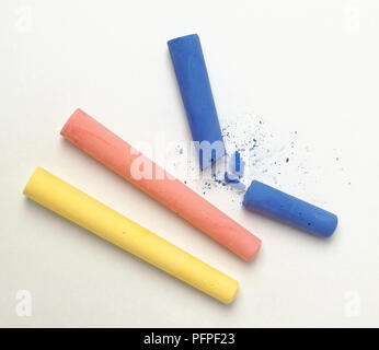 Three pieces of chalk Stock Photo - Alamy