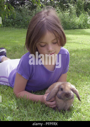 Close-up of rabbit on grass field Stock Photo - Alamy