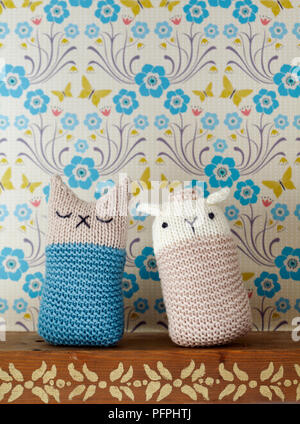 Knitted cat and sheep, front view Stock Photo - Alamy