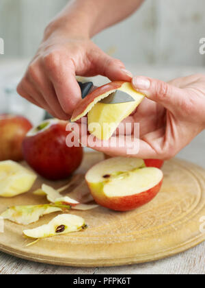 Peeling an apple with a knife Stock Photo - Alamy