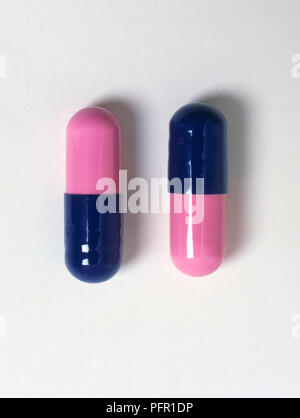 Close up of pink and blue Amoxicillin antibiotics capsule pills ...