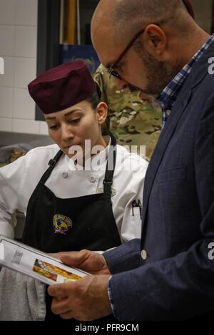 U.S. Army Sgt. Daniela Archbold (left), a culinary specialist, assigned ...