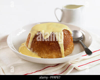 Treacle sponge pudding and custard Stock Photo - Alamy