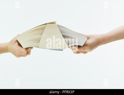 Two books with pages interleaved Stock Photo - Alamy