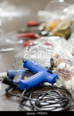 Handmade decorative frame from spruce branches on gray wooden wall, top ...