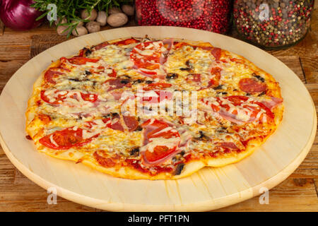 Delicious "4 seasons" pizza with tomatoes Stock Photo - Alamy