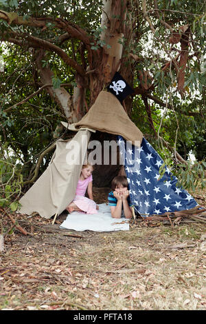 Girl (12-13) lying in bed covering her face Stock Photo - Alamy