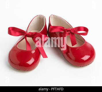 Red patent ribbon tie shoes Stock Photo - Alamy