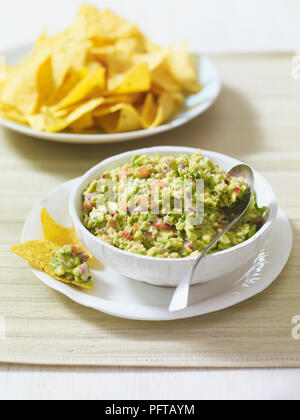 Bowl of guacamole with tortilla chips Stock Photo - Alamy