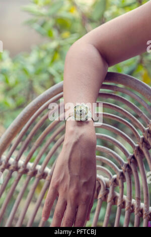 Tiny fashionable female bracelet on wooden background Stock Photo - Alamy
