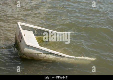 Small boat is sinking in the sea Stock Photo - Alamy