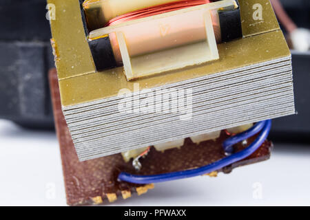 Old integrated circuits in an analog radio receiver. Resistors ...
