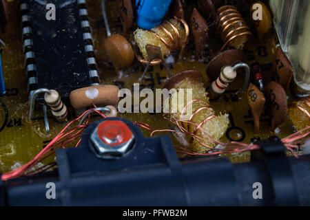 Old integrated circuits in an analog radio receiver. Resistors ...