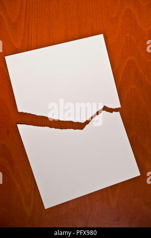 White Ripped Paper in Half on Wood Background. White torn paper 2 part ...