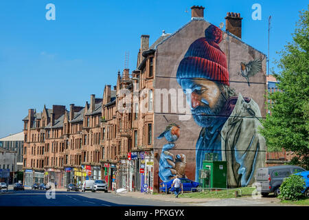Glasgow High Street Mural of a man holding a robin by Smug Stock Photo ...