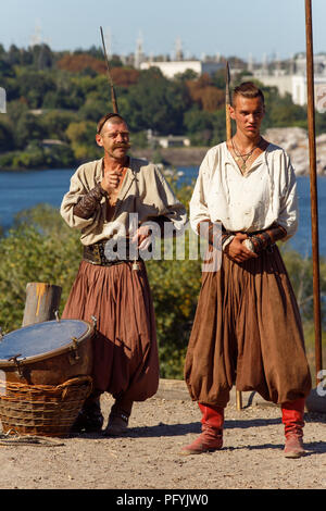 Cossack in thought with her hands folded on his belt on the island of ...