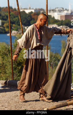 Kazak lifting the cloak on the island of Khortytsya. Zaporozhye ...