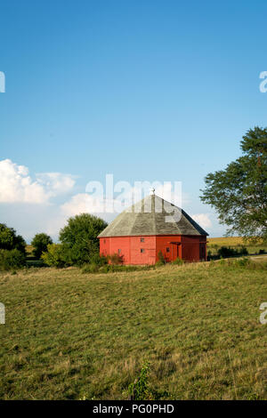 Unique round red barn surrounded by open farmland in rural illinois ...